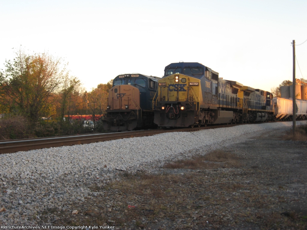 NB freight Q540 passes some grain train power on the GNRR interchangeNB freight Q540 passes some ...
